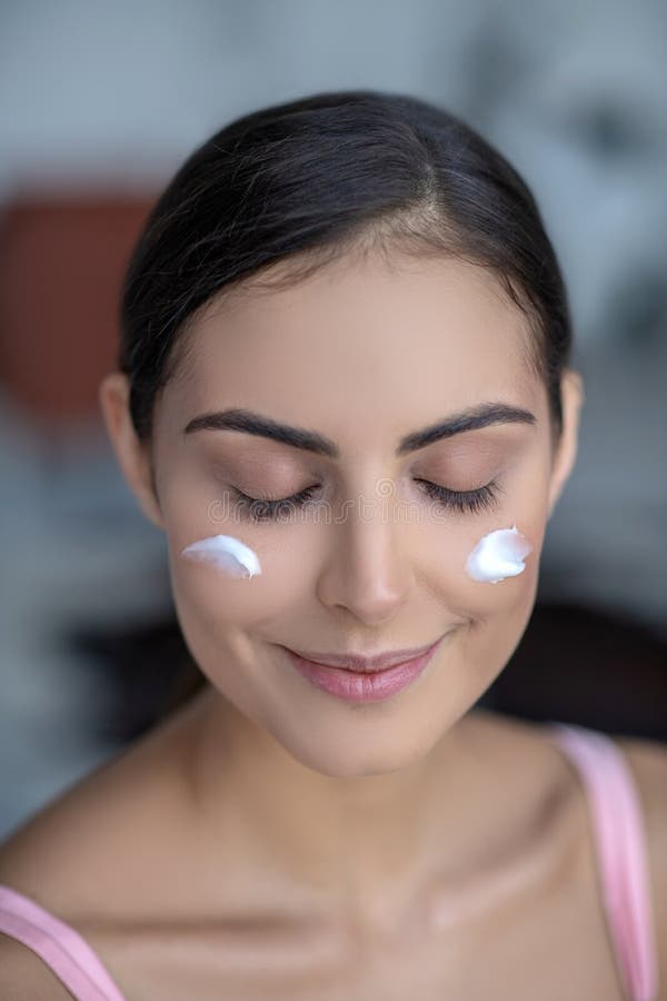 Cute Woman with Cream on Her Cheeks Feeling Relaxed Stock Photo - Image ...