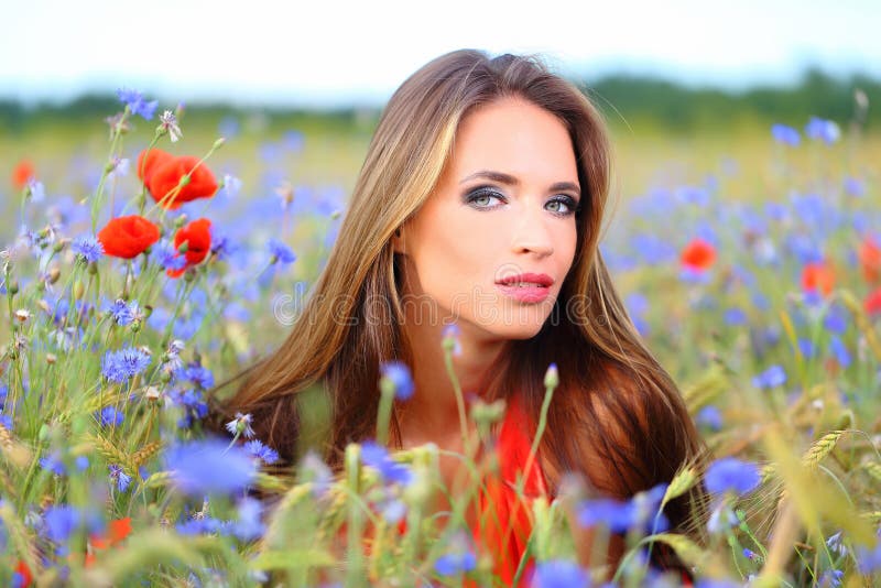 Cute woman on flower field stock photo. Image of portrait - 42648870