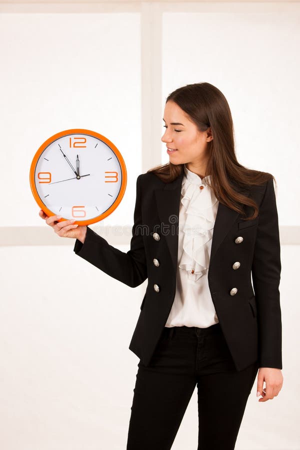 Cute Woman Holding a Clock As a Symbol of Time Management Stock Photo ...