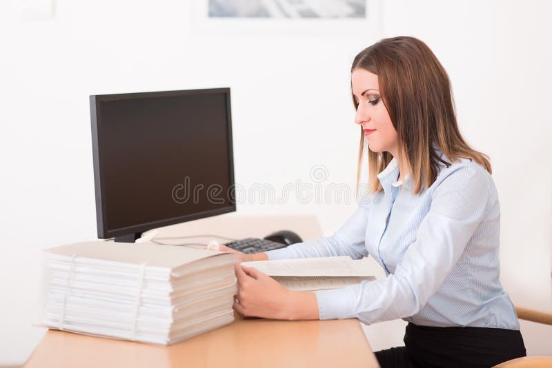 Woman Reading a Document in the Office Stock Image - Image of corporate ...