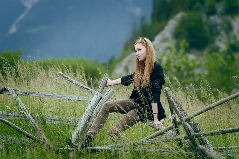 Cute Woman Sitting on Fence Stock Image - Image of nature, meditating ...