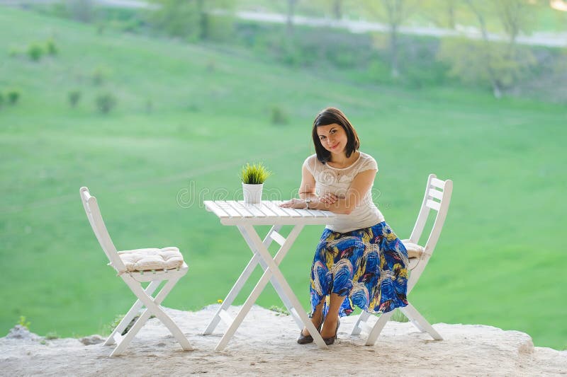 Cute Woman at Table stock image. Image of outdoors, apple - 57266667