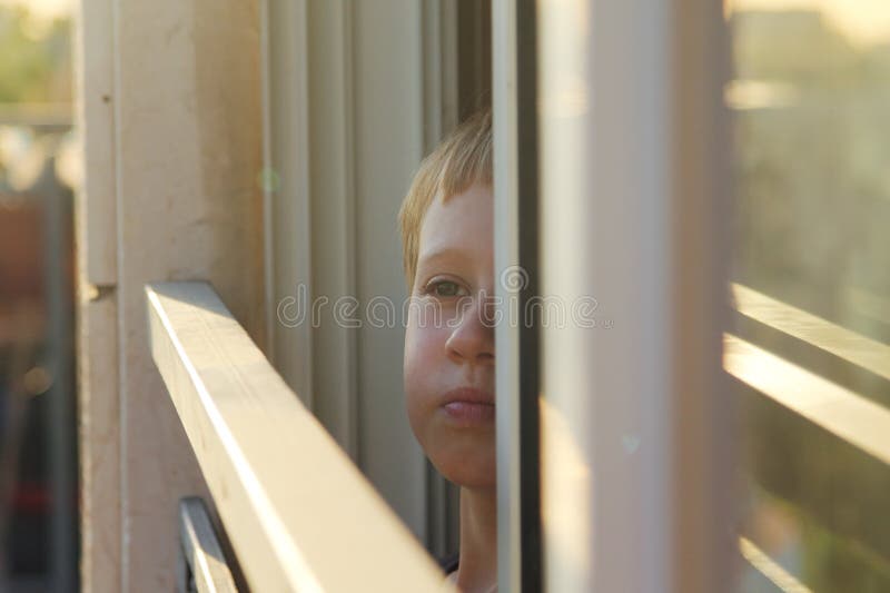 Cute 7 Years Old Boy Looks Out the Window Stock Photo - Image of hair ...