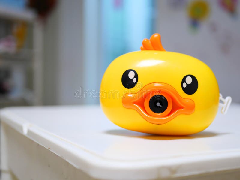 A Little Duck Bubble Machine on the Table Stock Photo - Image of warm ...