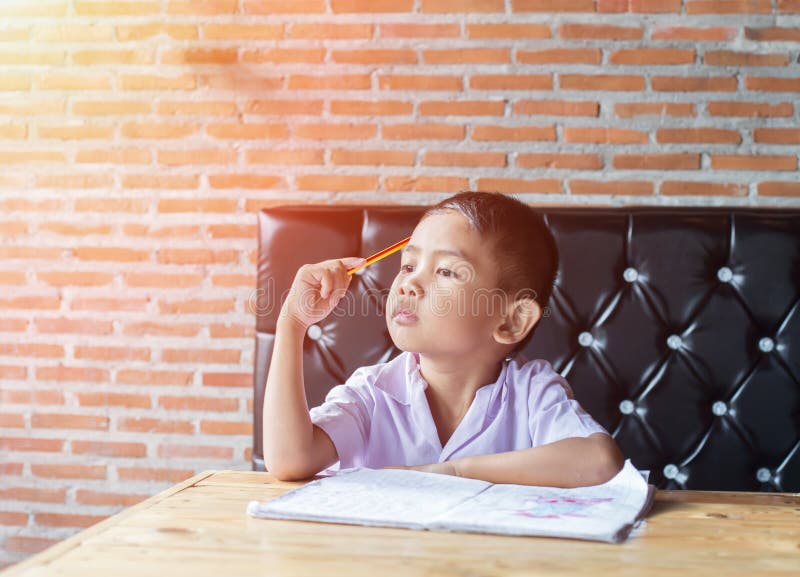 Cute Young Boy Doing Homework Stock Photo - Image of pencil, keen ...