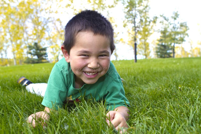 52+ Cute boy laying grass Free Stock Photos - StockFreeImages
