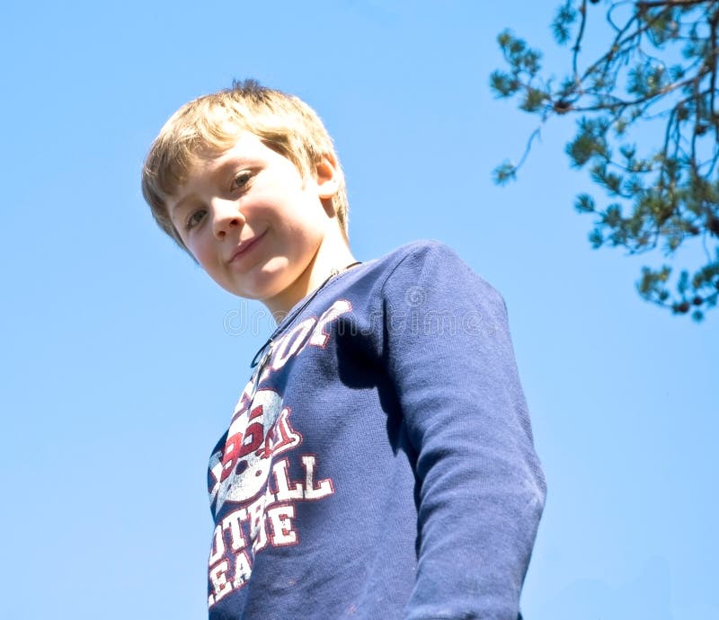 Cute Young Boy Looking Down Stock Image - Image of blond, person: 9301859