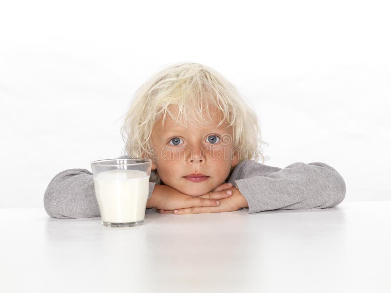 Cute, young boy with milk stock image. Image of blonde - 10573465
