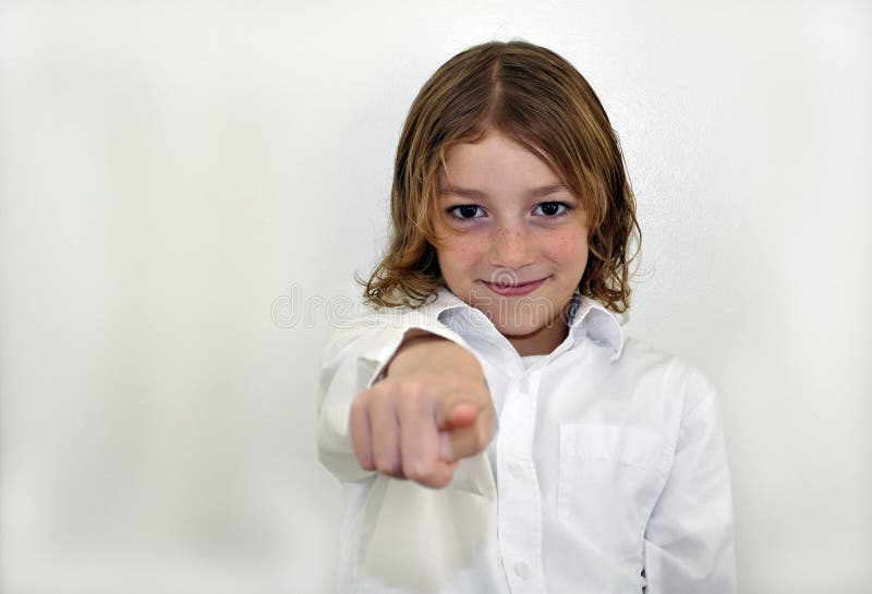Cute Young Boy Pointing and Smiling Stock Photo - Image of blond ...