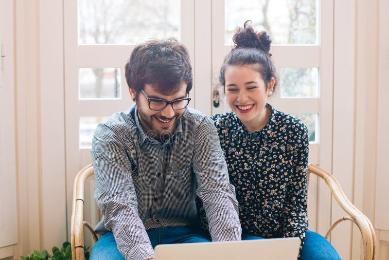 Cute Young Couple with Laptop Stock Photo - Image of together, pretty ...