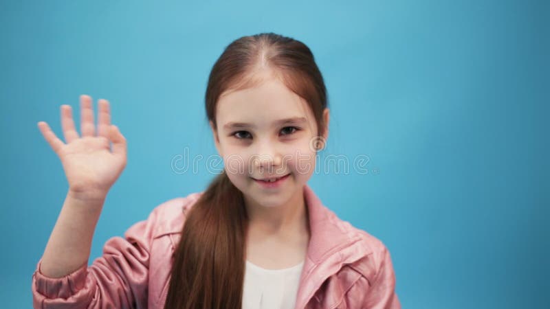 Girl Waves Hello Against the Background of the Painted Floor Stock ...