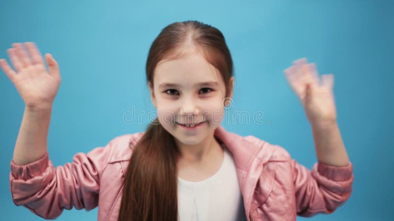 Girl Waves Hello Against the Background of the Painted Floor Stock ...