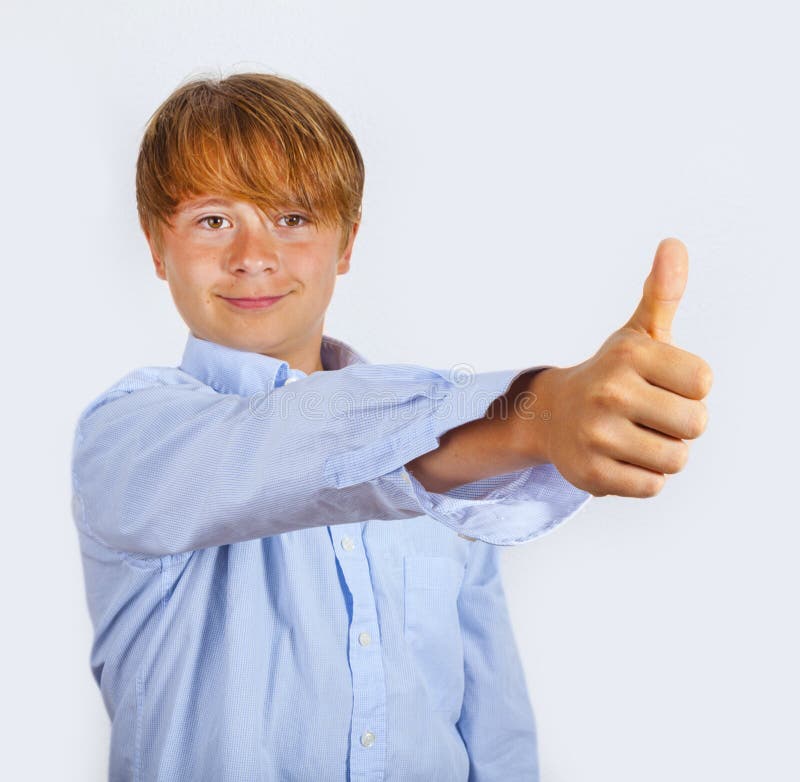Cute Young Happy Boy in Studio Shows I Like it Sign with His Thu Stock ...