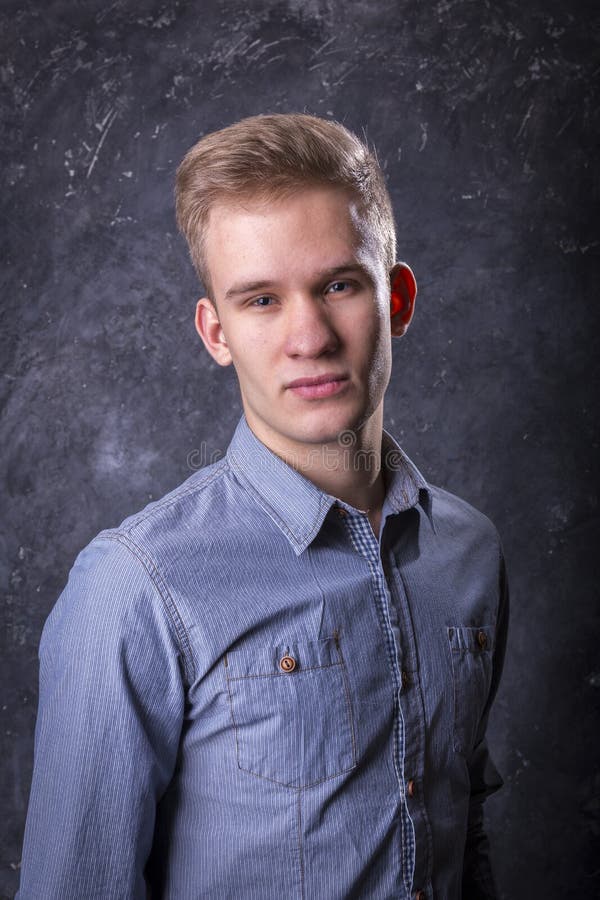 Cute Young Man Dressed in Casual Studio Portrait. Stock Photo - Image ...