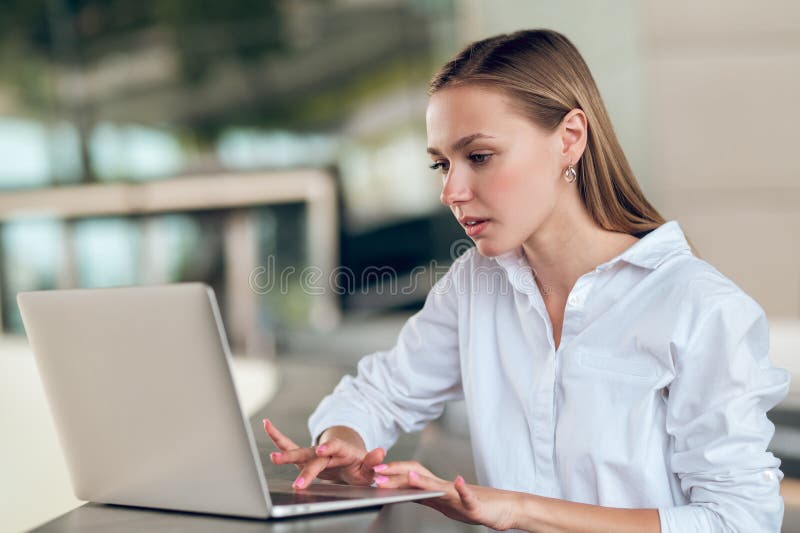 Cute Young Manager Working on a Laptop Stock Image - Image of ...