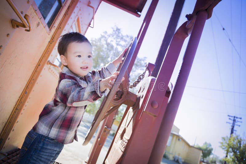 Cute Young Mixed Race Boy Having Fun on Railroad Car Stock Image ...