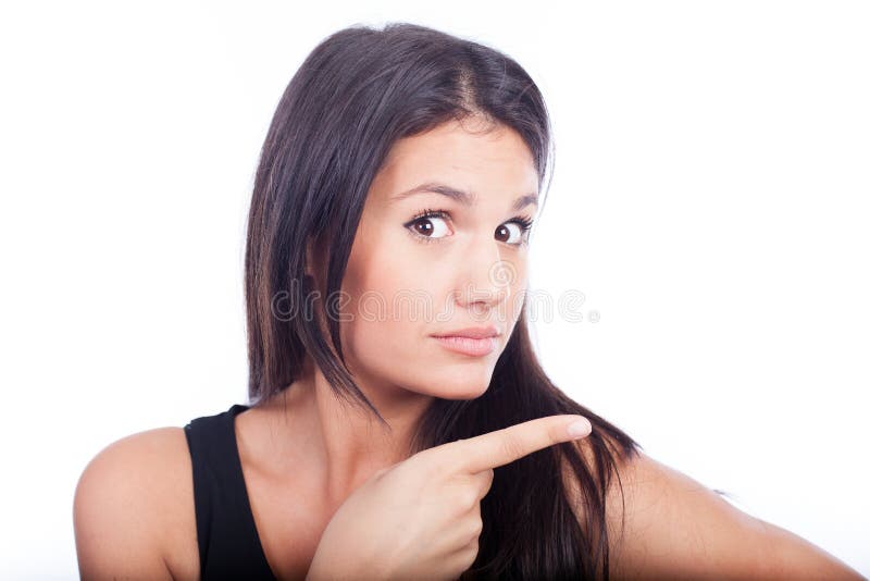 Cute Young Woman Pointing To the Side Stock Photo - Image of copyspace ...