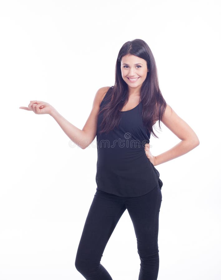 Cute Young Woman Pointing To the Side Stock Photo - Image of copyspace ...