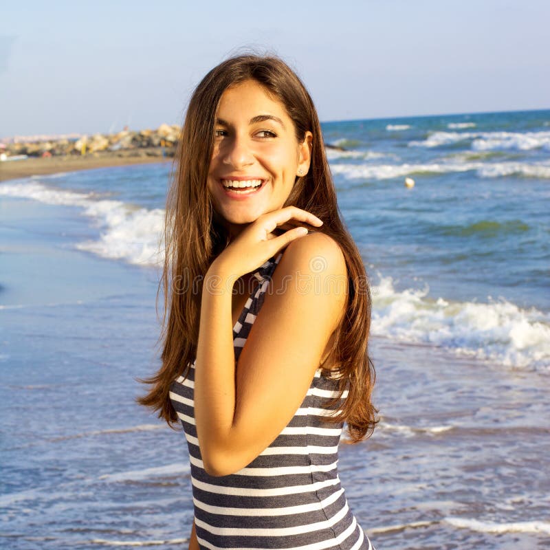 Cute Young Woman Relaxing during Vacation on the Beach Stock Photo ...