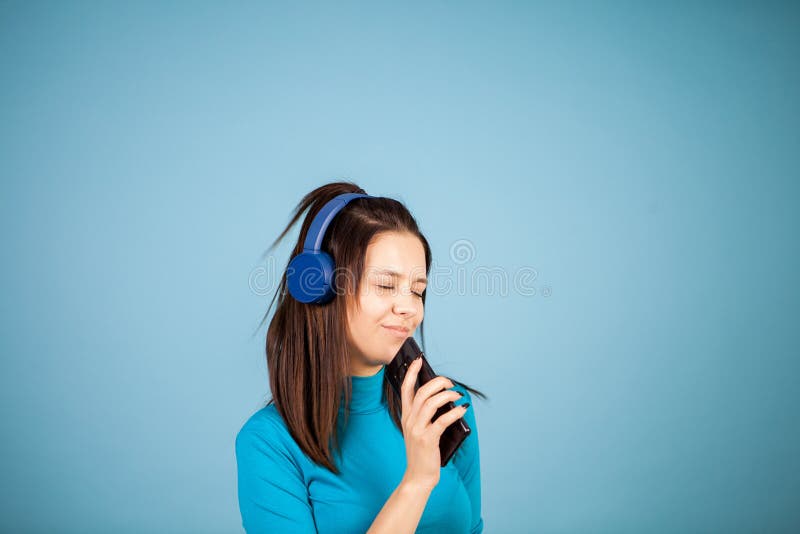Cute Young Woman Singing on Her Phone Stock Photo - Image of blue ...