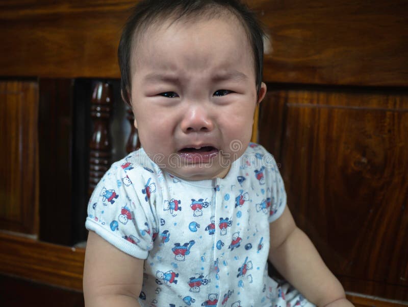 Cutie asian infant crying stock photo. Image of beautiful - 130592470