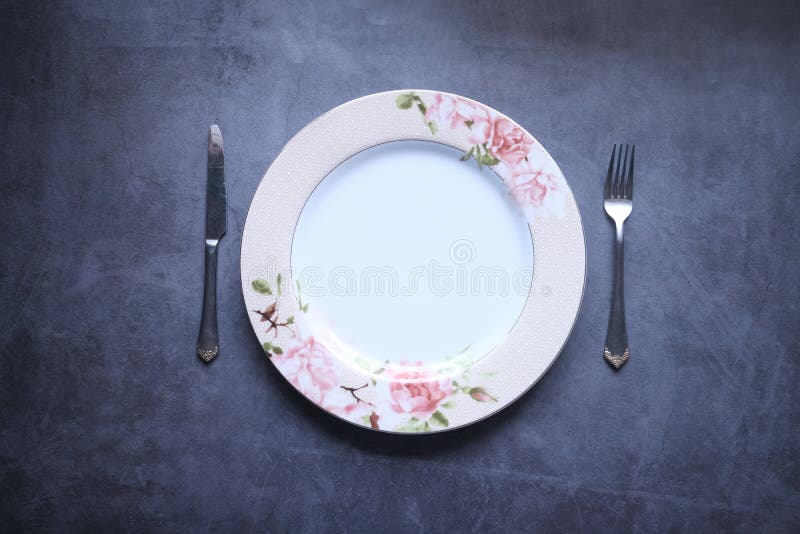 Cutlery and Empty Plate on Black Background Top Down Stock Photo ...