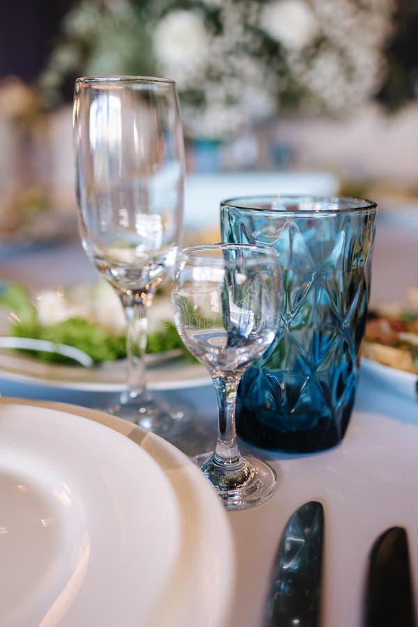 Cutlery and Glasses on the Table. Blue Elements of Decor Using in ...