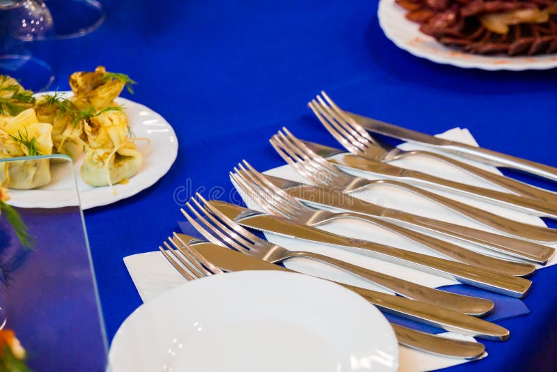 Cutlery: Knives, Forks and Plates at the Buffet. Catering Stock Image ...