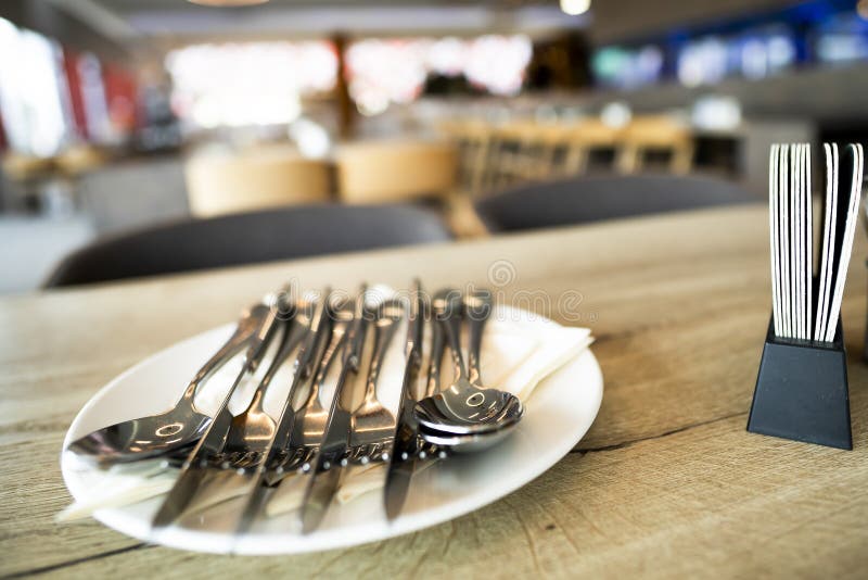 Cutlery on a Plate in a Restaurant Stock Image - Image of floor ...