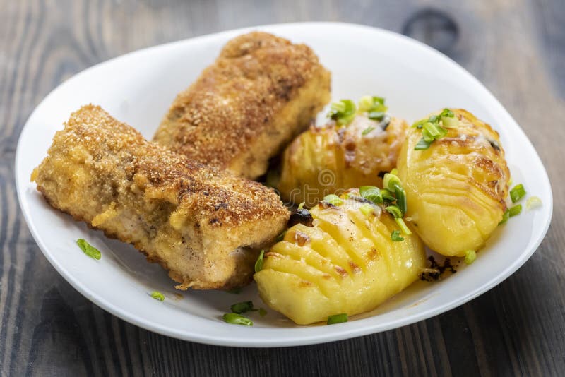 Cutlet Cordon Bleu and Hasselback Potatoes Stock Image - Image of ...