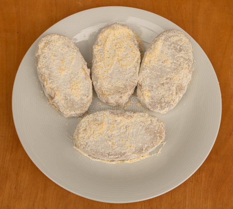 Cutlet on a Plate in the Cooking Process, Sprinkled Flour on Them and ...