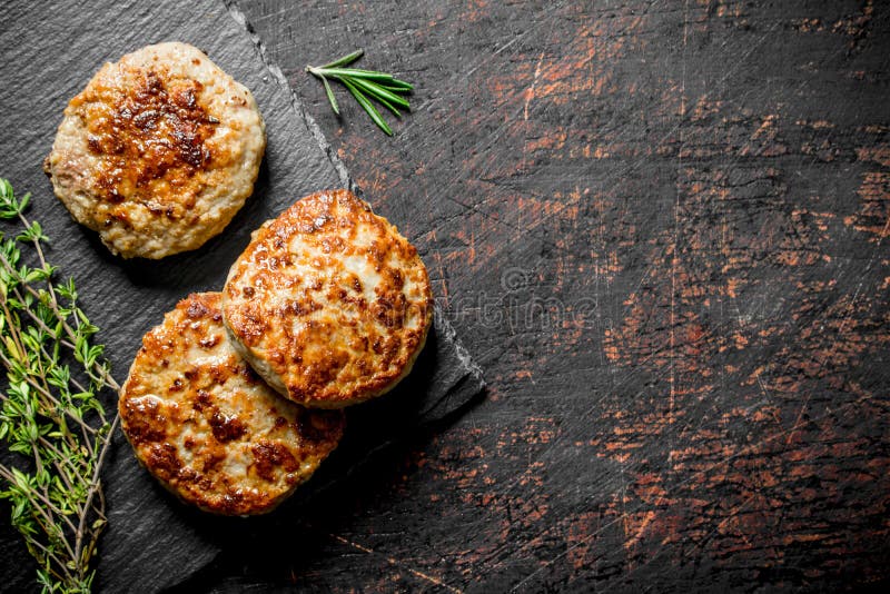 Cutlets on a Black Stone Board with Thyme Stock Image - Image of ...