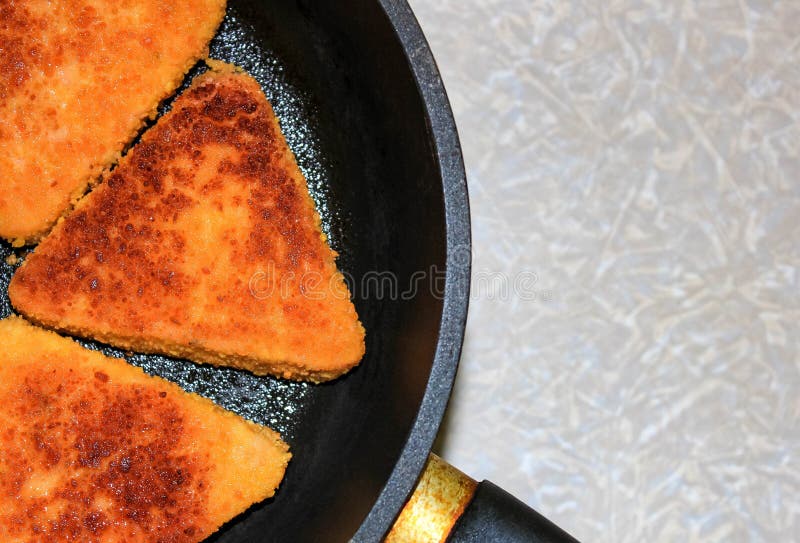 Cutlets of Triangular Shape are Fried in a Frying Pan Stock Photo ...