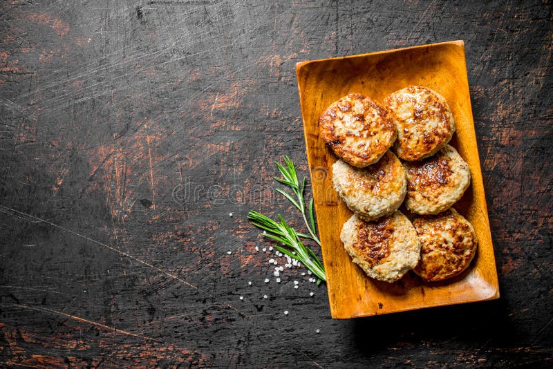Cutlets on a Wooden Plate with Rosemary Stock Image - Image of juicy ...