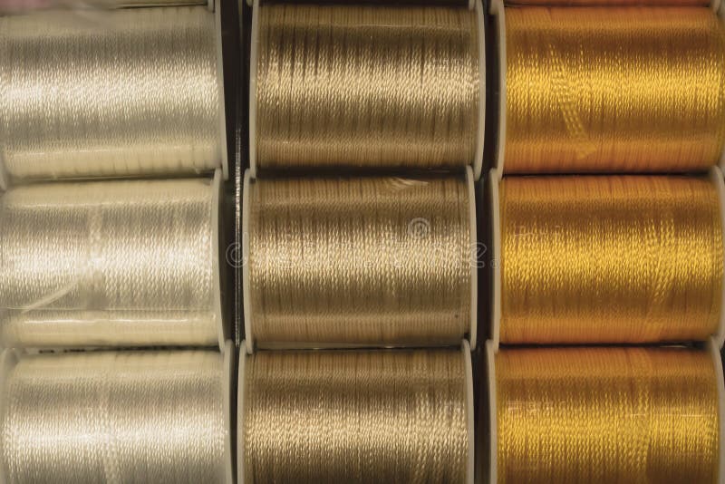 Cutout Texture Closeup on Coils of Colored Sewing Threads White,gold ...