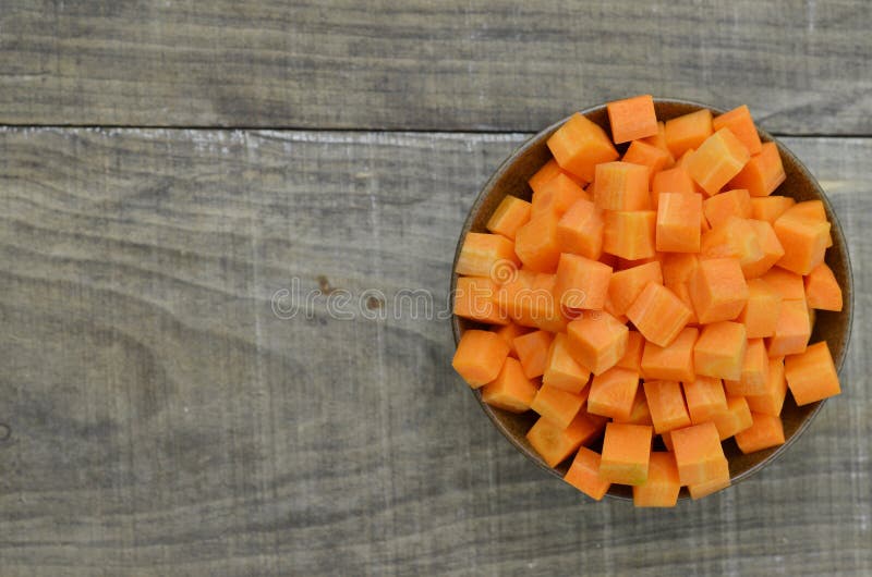Cuts Cubes of Carrot in Black Bowl on Wooden Background Stock Photo ...