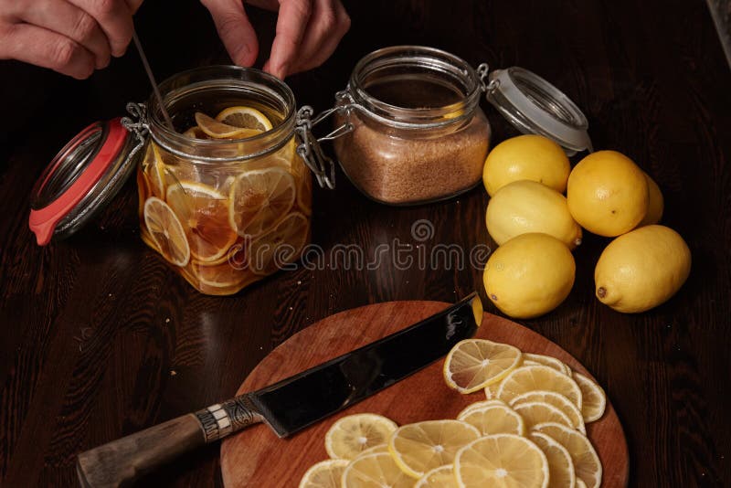 The Man Cuts Lemons for Preservation Stock Photo - Image of person ...