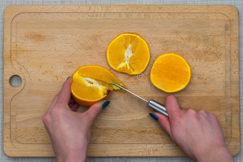 Cutted Orange on a Wooden Board Stock Image - Image of apron, board ...