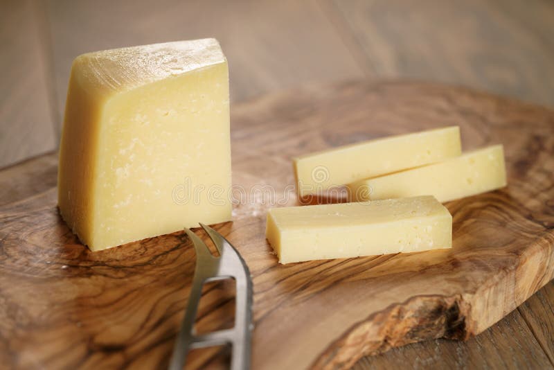 Cutted Parmesan Cheese on Olive Cutting Board Stock Image - Image of ...