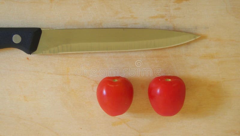 Cutted tomatoes and knife stock image. Image of eating - 127465539