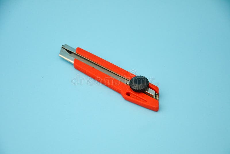 Cutter Isolated on Blue Background Stock Photo - Image of cardboard ...