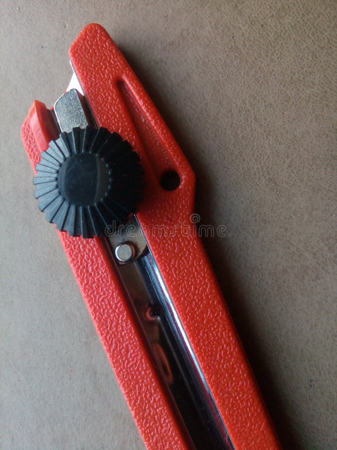 Cutter Knife Handle on the Book Stock Photo - Image of handle, cutter ...