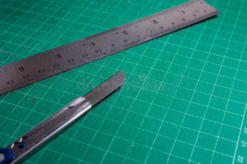 Cutter and Steel Ruler on Cutting Pad, Office Stationery Tools Stock ...