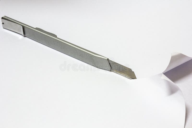 Cutter and white paper stock photo. Image of knife, artwork - 30915288