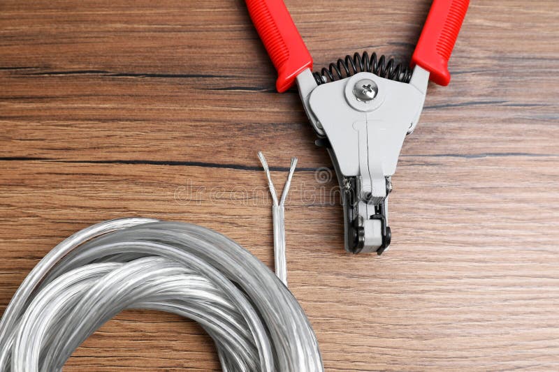 Cutters and Cable with Stripped Wire on Wooden Table, Flat Lay Stock ...