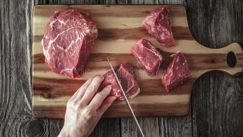 Cutting Angus Beef on the Wooden Table Top View Stock Photo - Image of ...
