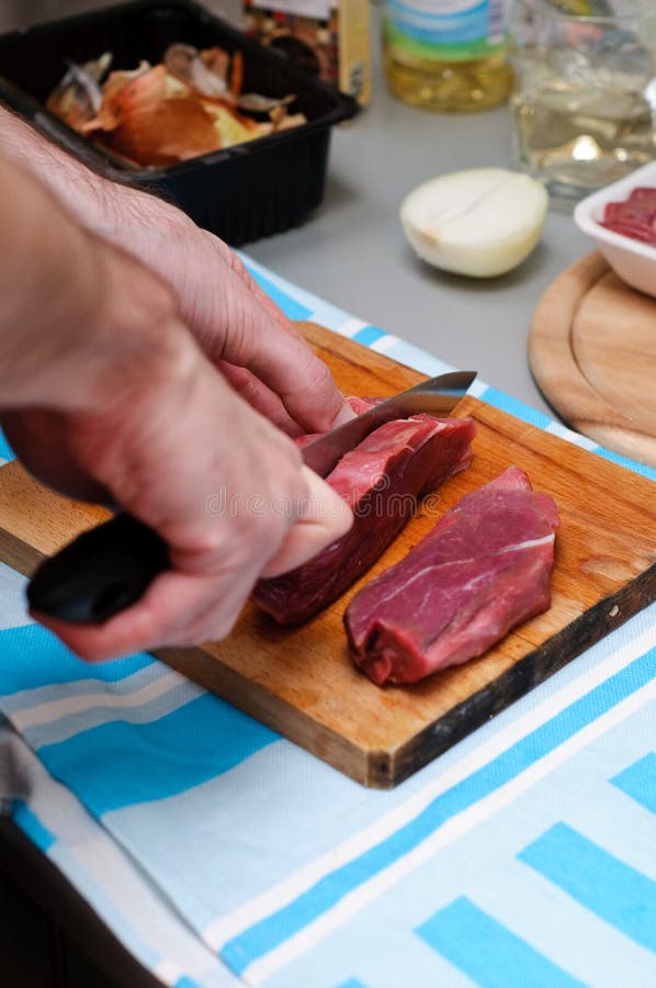 Cutting beef meat stock photo. Image of beef, cloth, kitchen - 21660796
