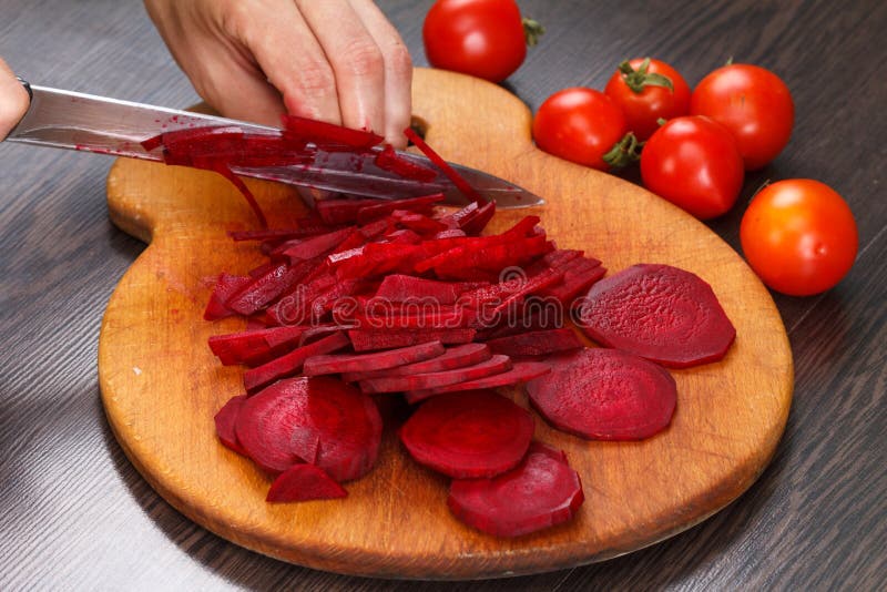 Cutting beet on a board stock image. Image of closeup - 74559579