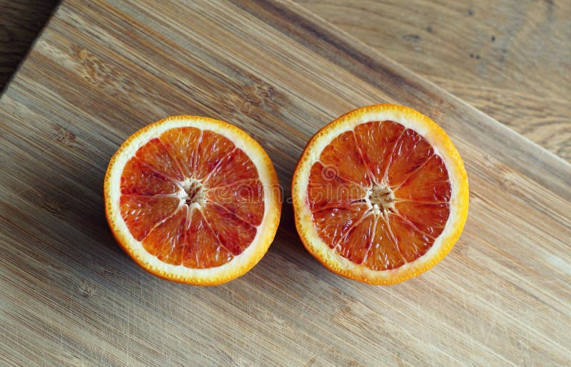 Cutting a Blood Orange in Half Stock Image - Image of symbol, organic ...
