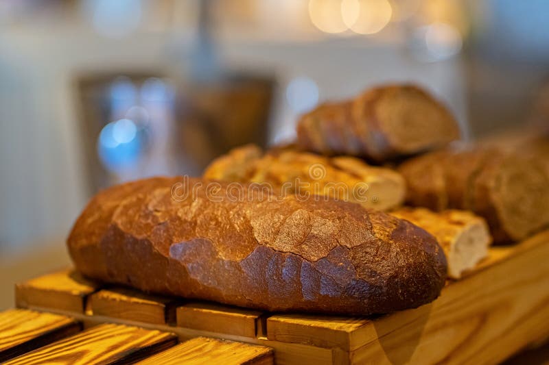 A Cutting Board with Bread on Self Service Table Breakfast Buffet in ...